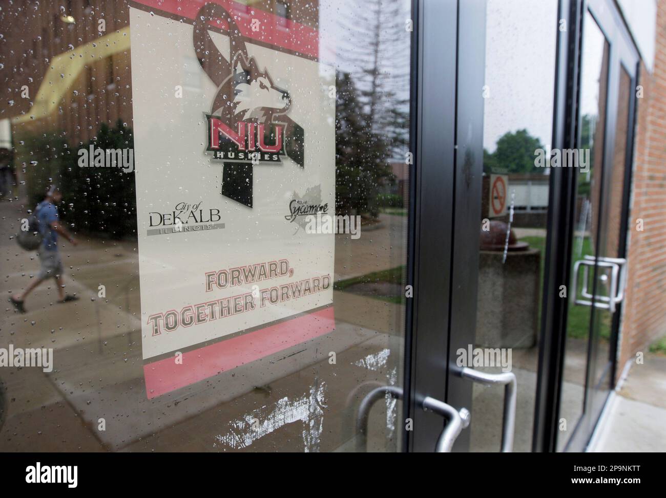 Signs in the windows of Northern Illinois University's Cole Hall with ...