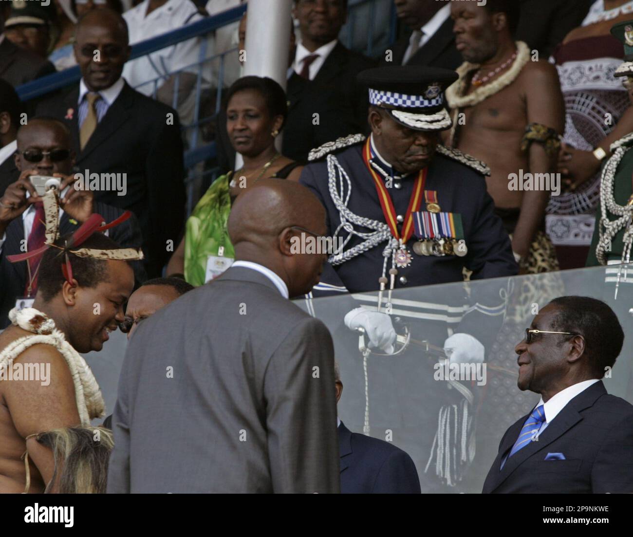 Zimbabwe President Robert Mugabe, right, reacts as Swaziland King ...