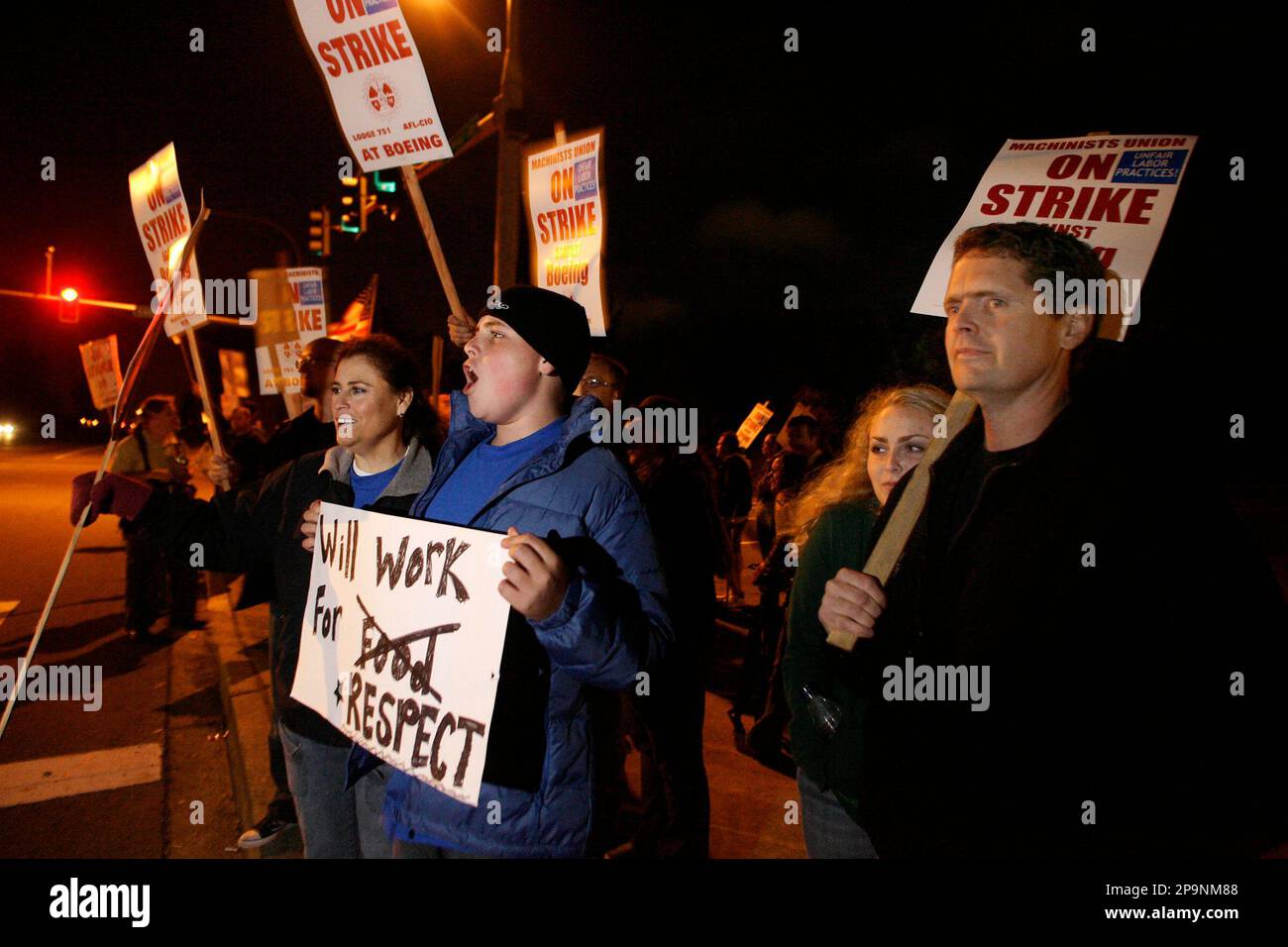 Boeing employee, Brian Gross, 46, right, next to his daughter, Amy, 16 ...
