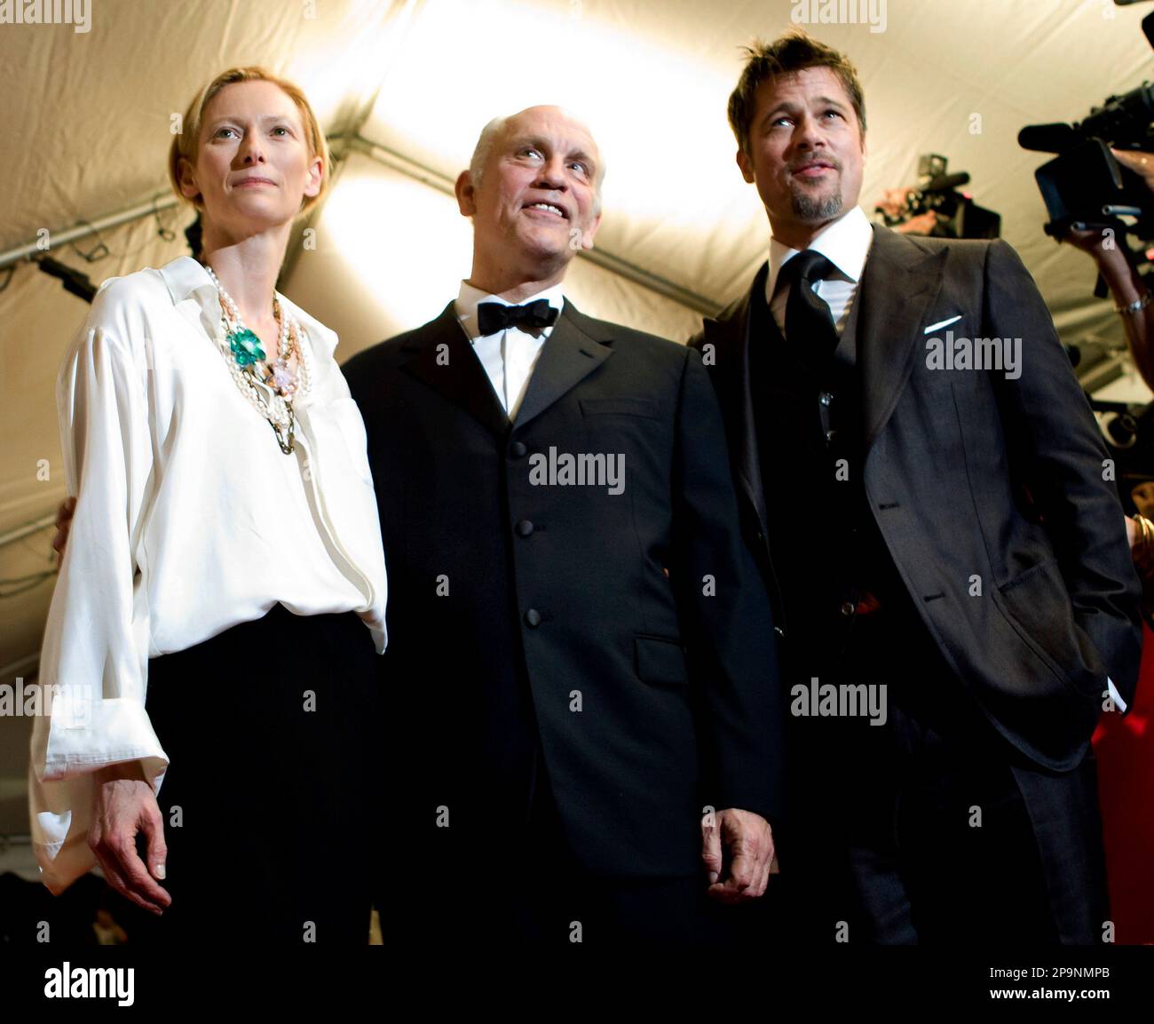 Actors Tilda Swinton, left, John Malkovich, center, and Brad Pitt pose ...