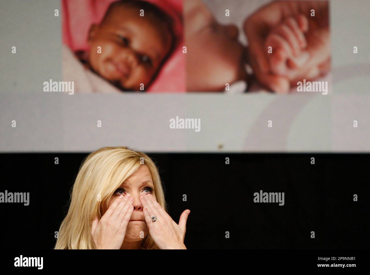 Renee Baio, wife of actor Scott Baio, wipes away tears from her face ...