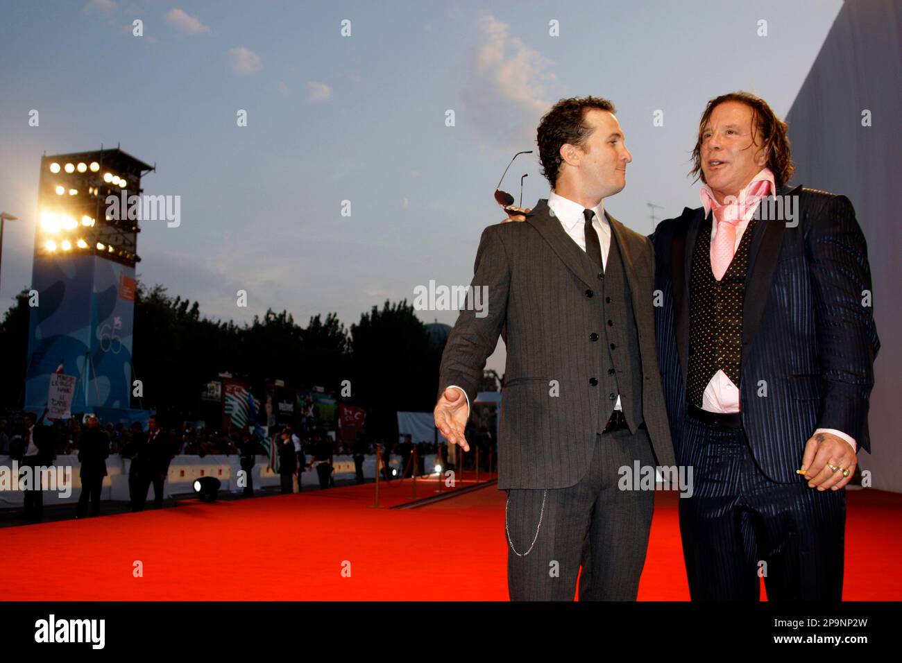 Actors Mickey Rourke, right, and Todd Barry arrive for the premiere of ...