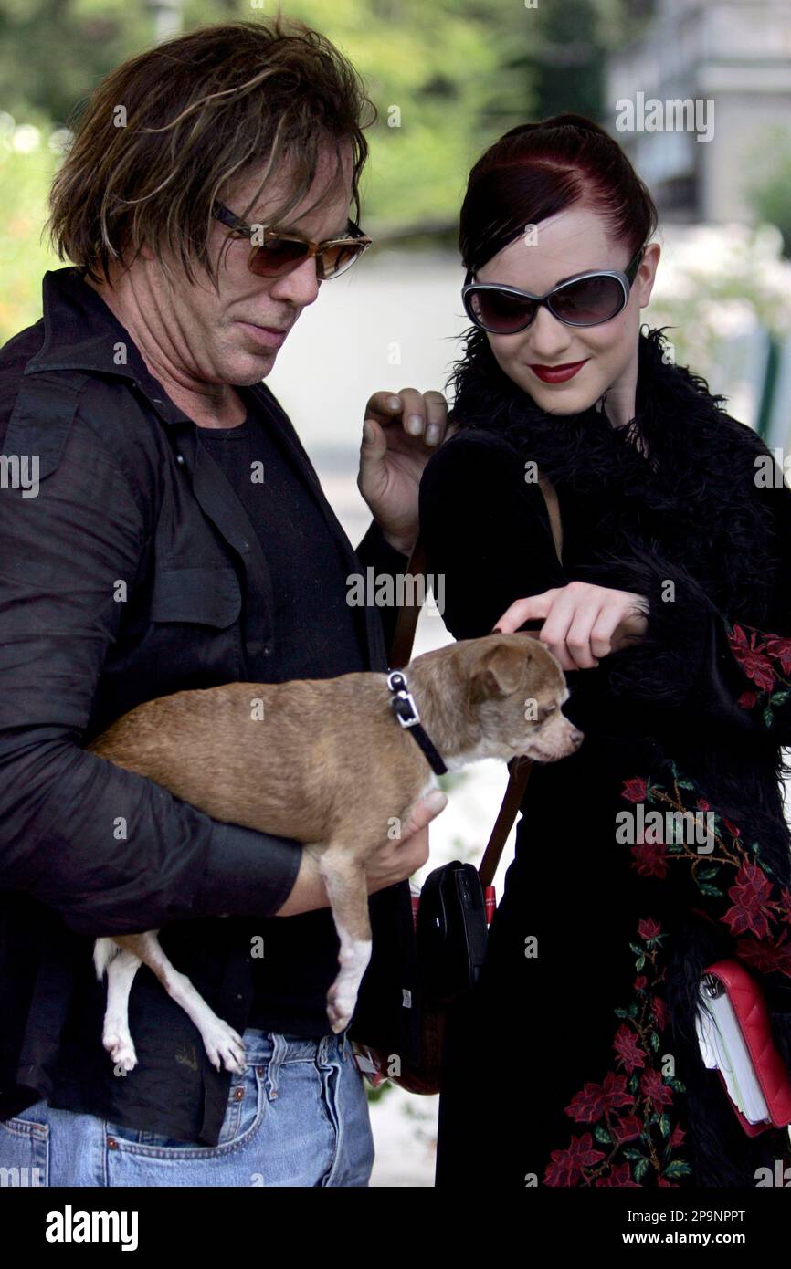 Actor Mickey Rourke, right, with his dog Loki, and actress Evan Rachel ...