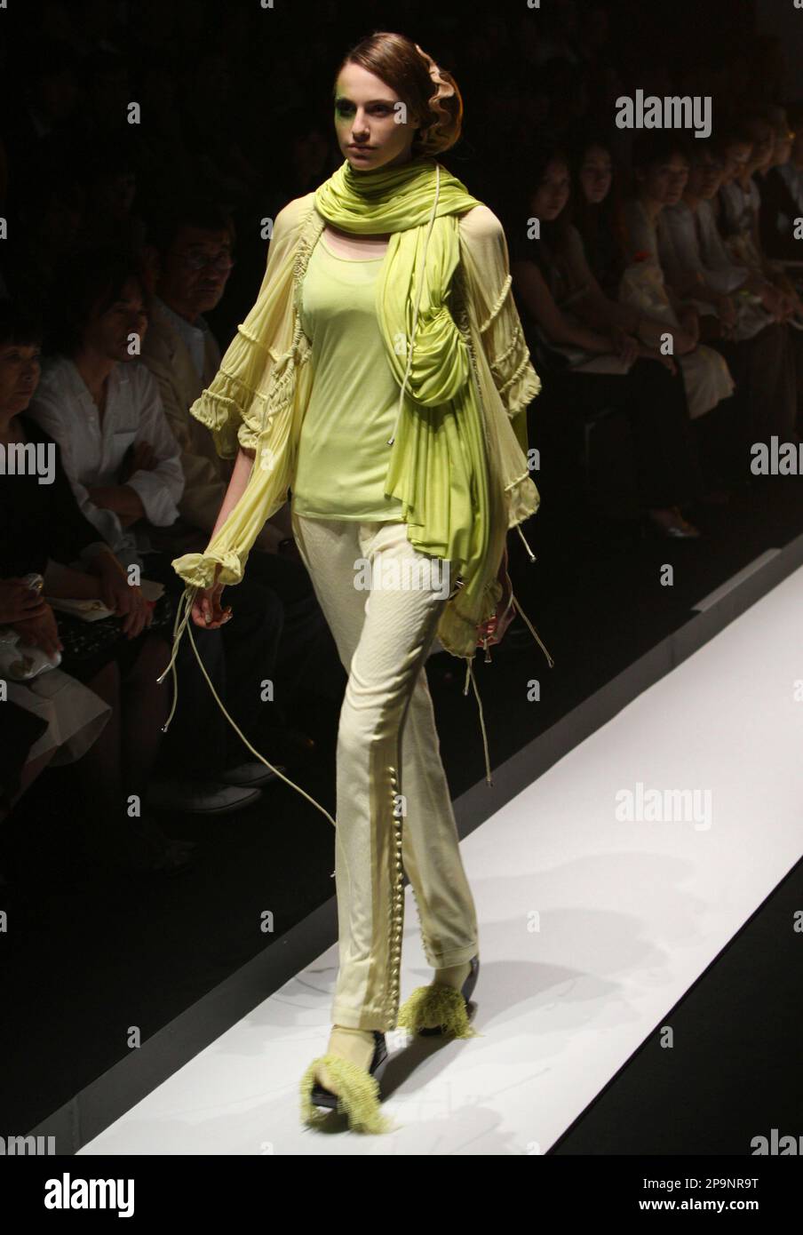 Model display Japanese designer Eriko Isoya's light green top and ...