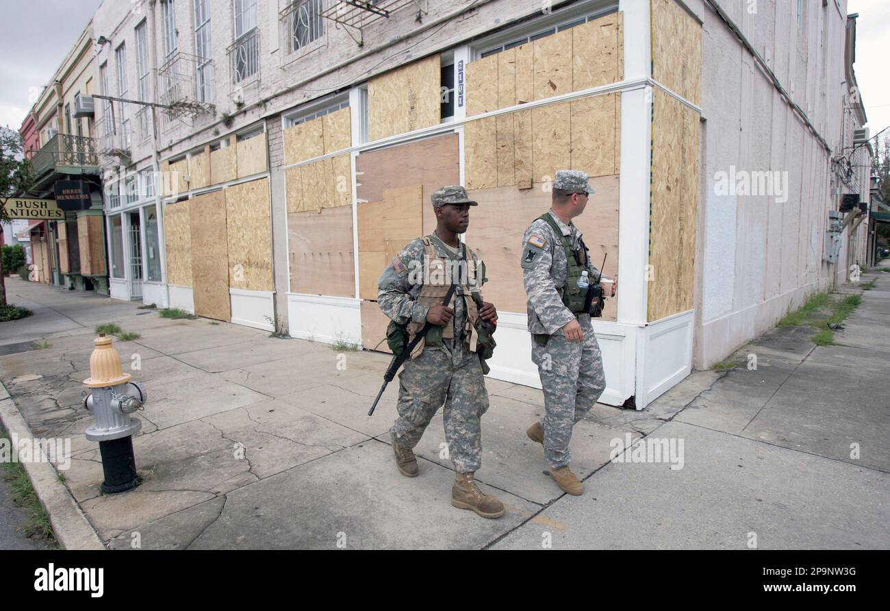 Army National Guardsmen Spec. Jacoby Golver of Shreveport, La., left ...