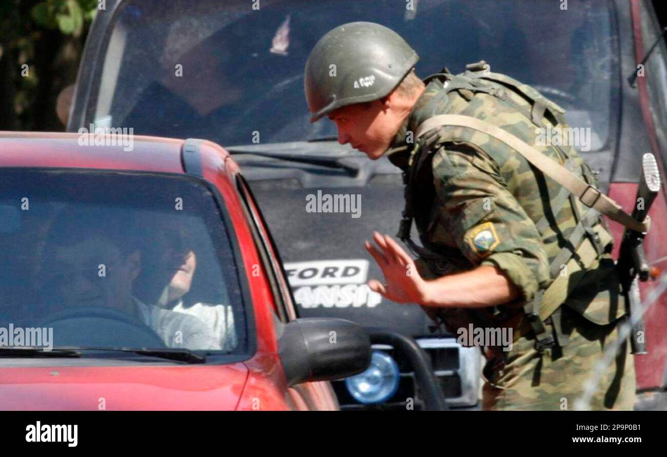 Russian soldier seen at a Russian checkpoint at Karaleti, 7 km (4 miles ...