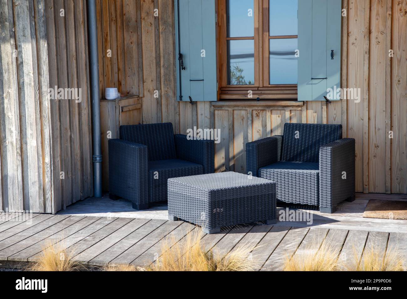 seat grey table terrace with wooden deck flooring on outdoor patio ...