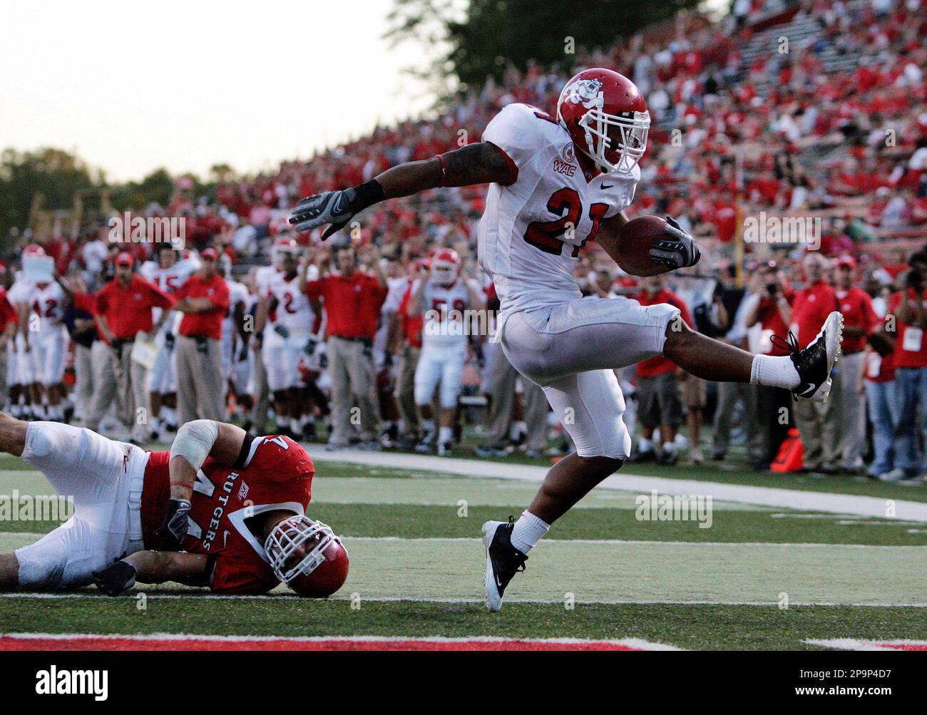 Fresno State running back Ryan Mathews (21) breaks a tackle by Rutgers ...