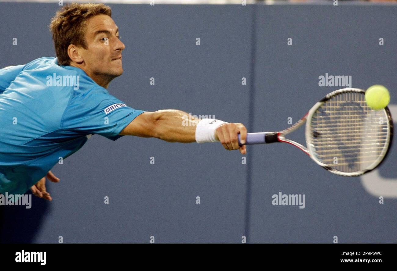 Tommy Robredo, of Spain, returns a shot against Jo-Wilfried Tsonga, of ...