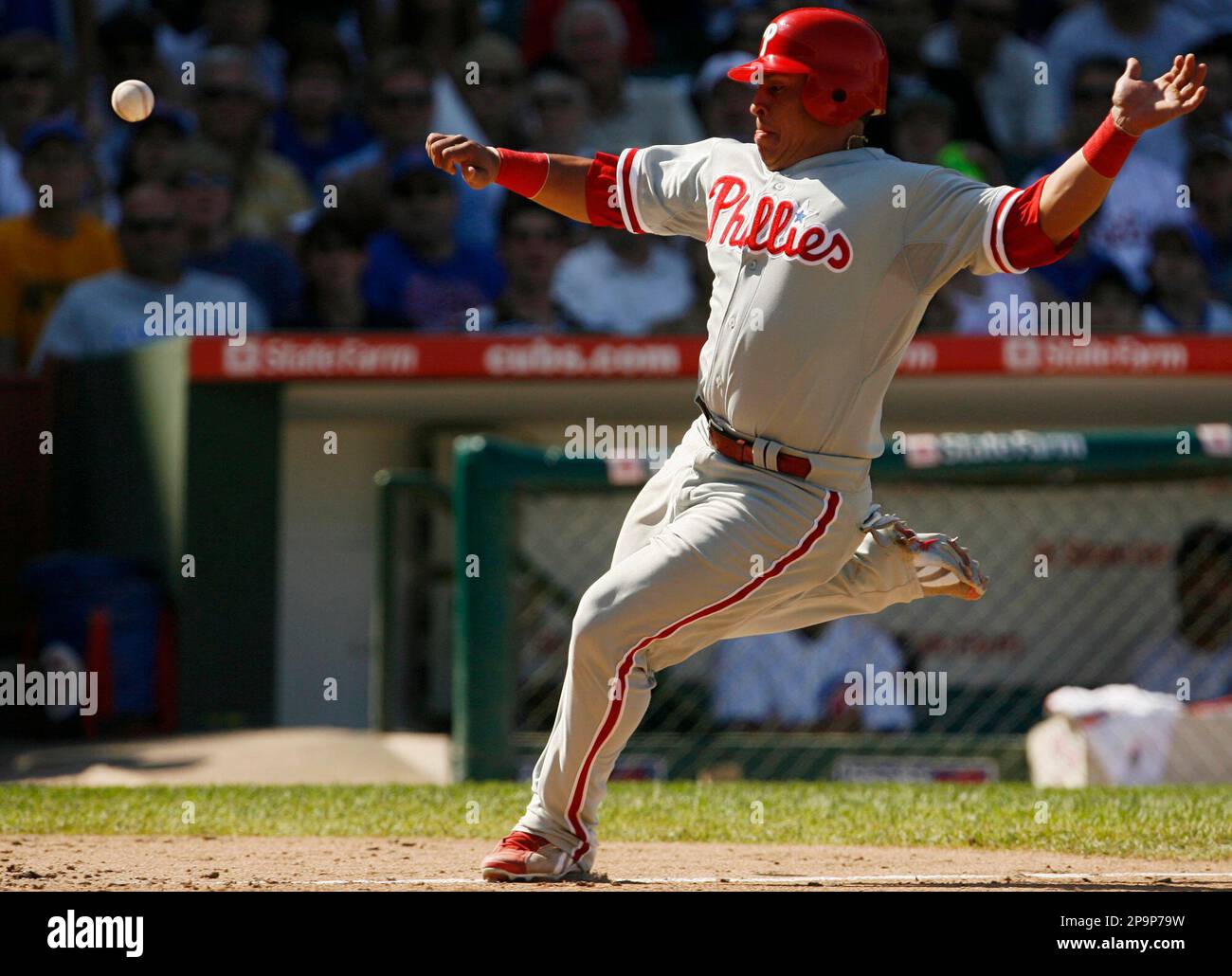 Philadelphia Phillies' Carlos Ruiz scores on a sacrifice fly by ...