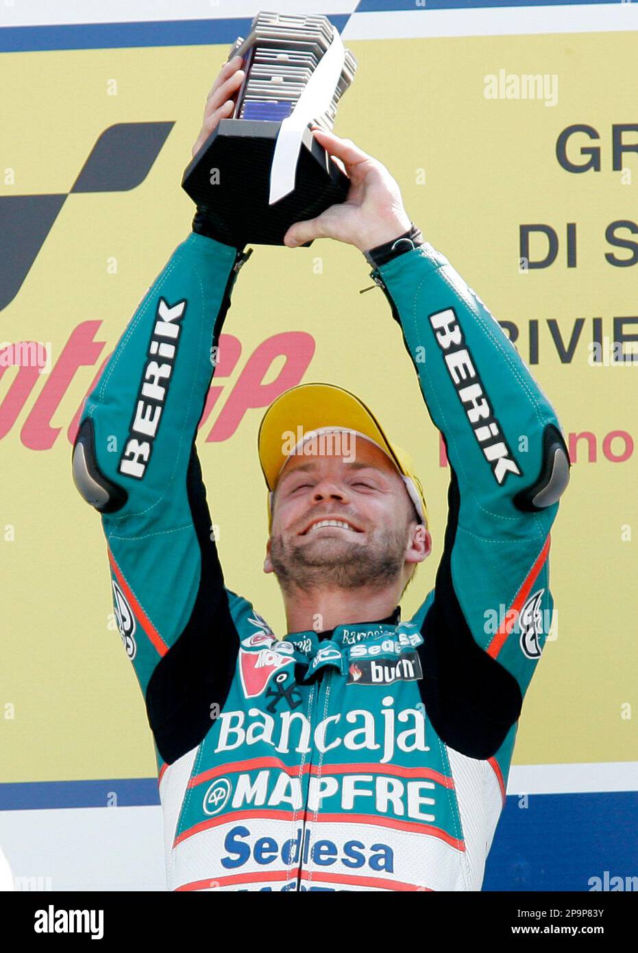 Aprilia rider Gabor Talmacsi, of Hungary, celebrates on the podium ...