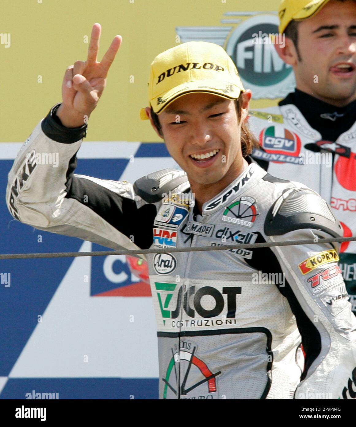 Honda rider Yuki Takahashi, of Japan, celebrates on the podium after ...