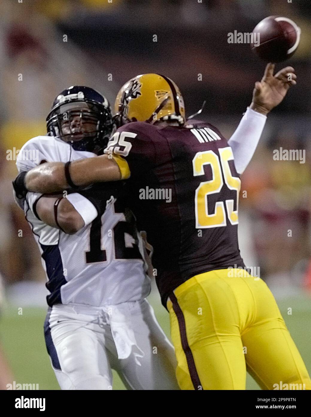 Northern Arizona quarterback Lance Kriesien, left, releases the ball ...