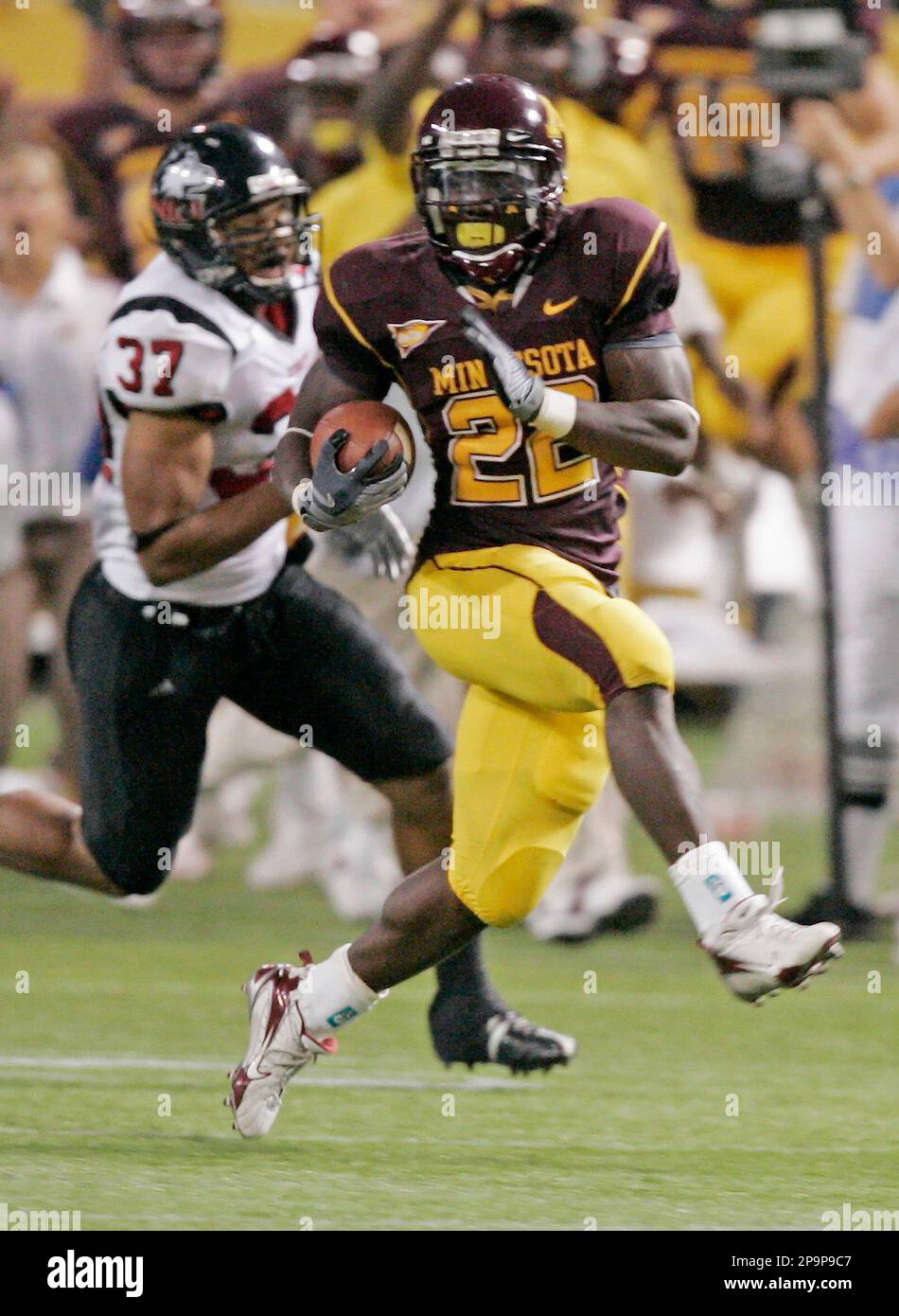 Northern Illinois linebacker Alex Kube,l eft, gives chase as Minnesota ...