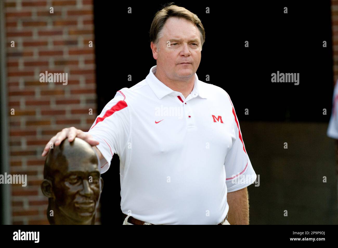 Mississippi coach Houston Nutt, rubs the head of Chucky Mullins for ...