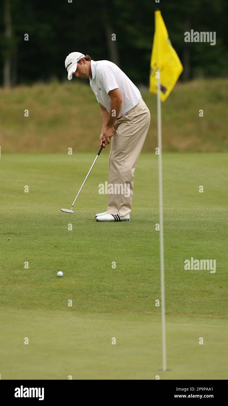 Sergio Garcia, from Spain, putts from off the green on the ninth hole ...