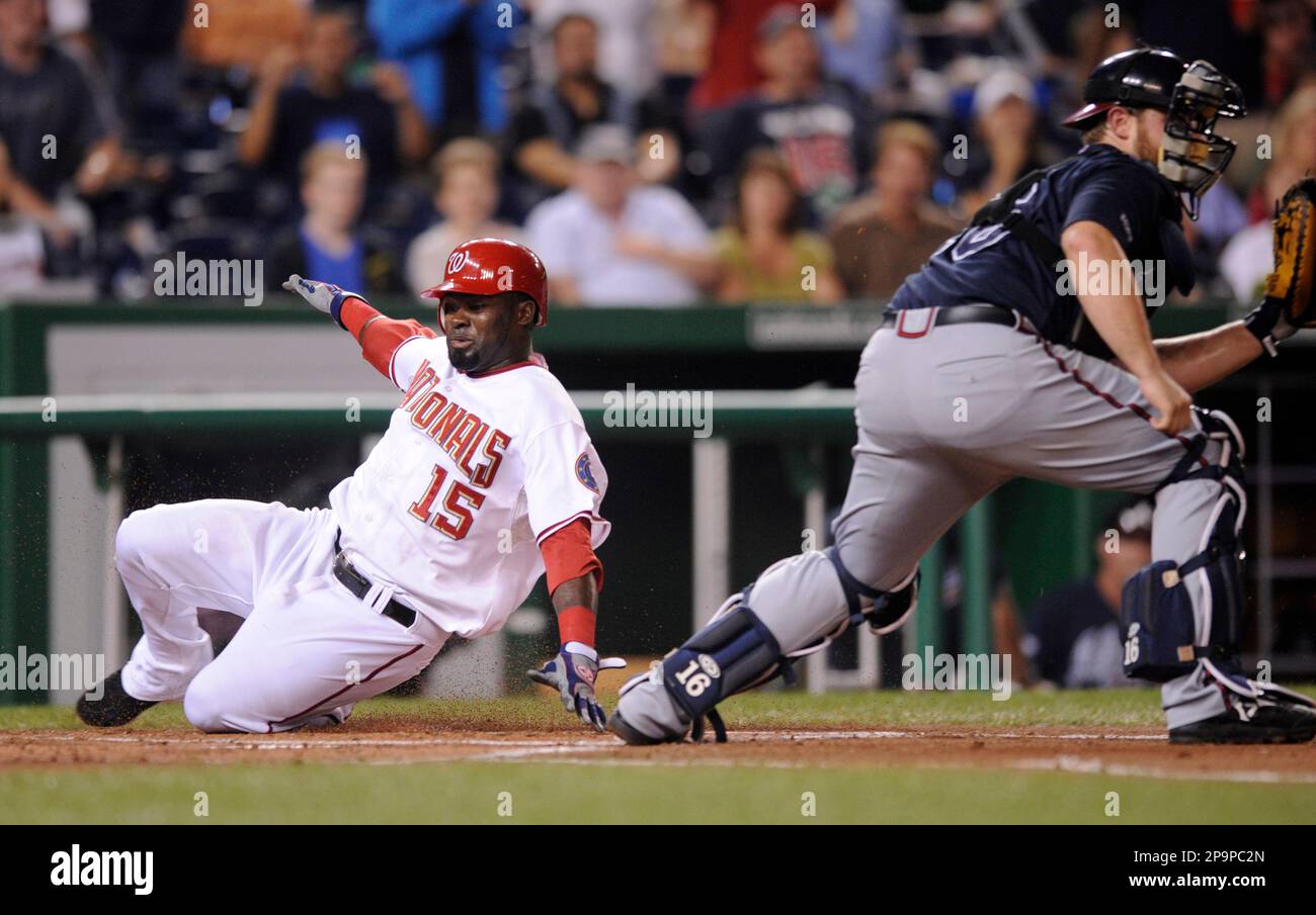 Washington Nationals' Cristian Guzman (15) slides home to score a run ...