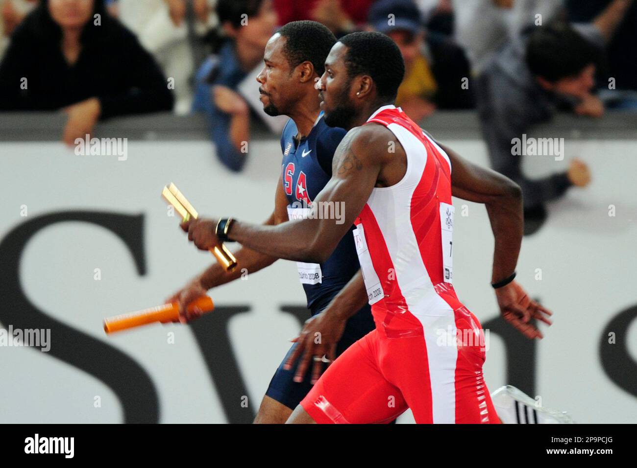 US Darvis Patton, left, runs to win the men's 4 x 100 m relay ahead of ...