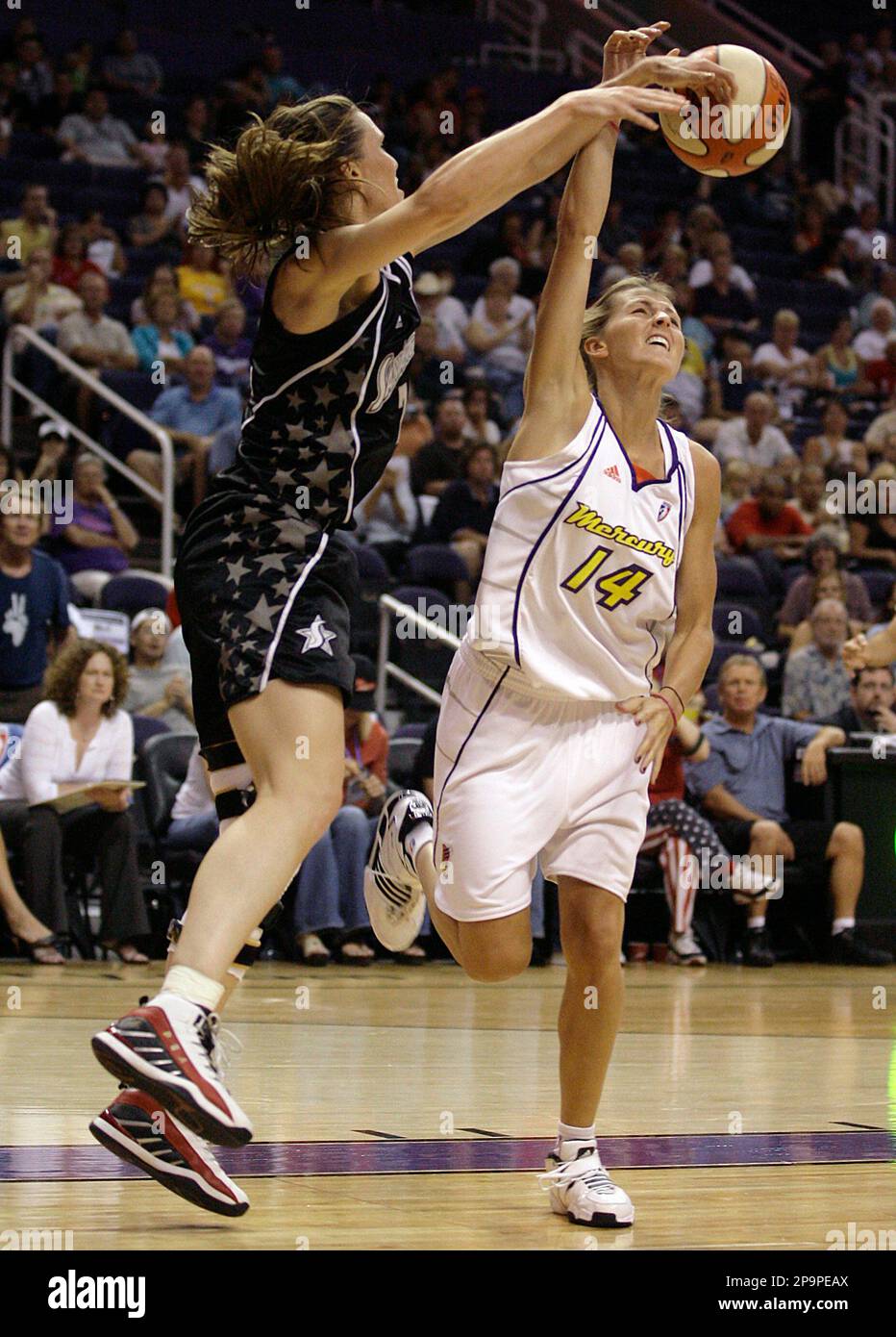 San Antonio Silver Stars guard Erin Buescher blocks the shot by Phoenix ...