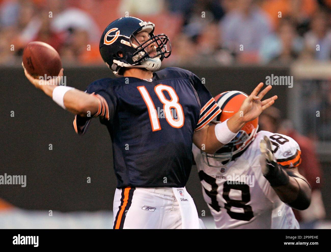 Chicago Bears quarterback Kyle Orton (18), under pressure from ...