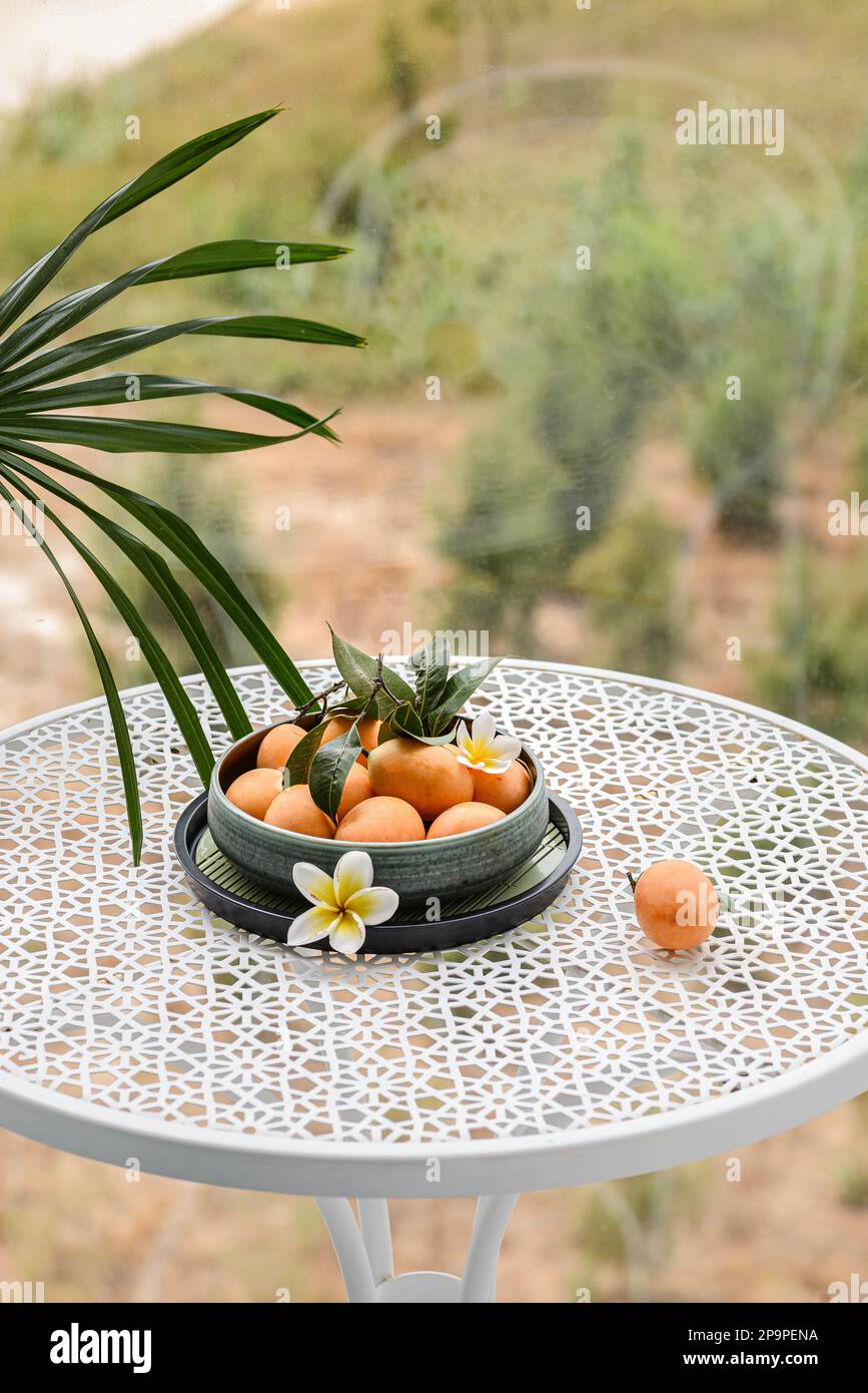 mango plum on the table on the balcony . High quality photo Stock Photo ...