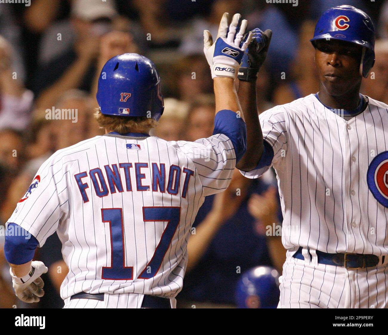 Chicago Cubs' Mike Fontenot, left, celebrates with teammate Alfonso ...