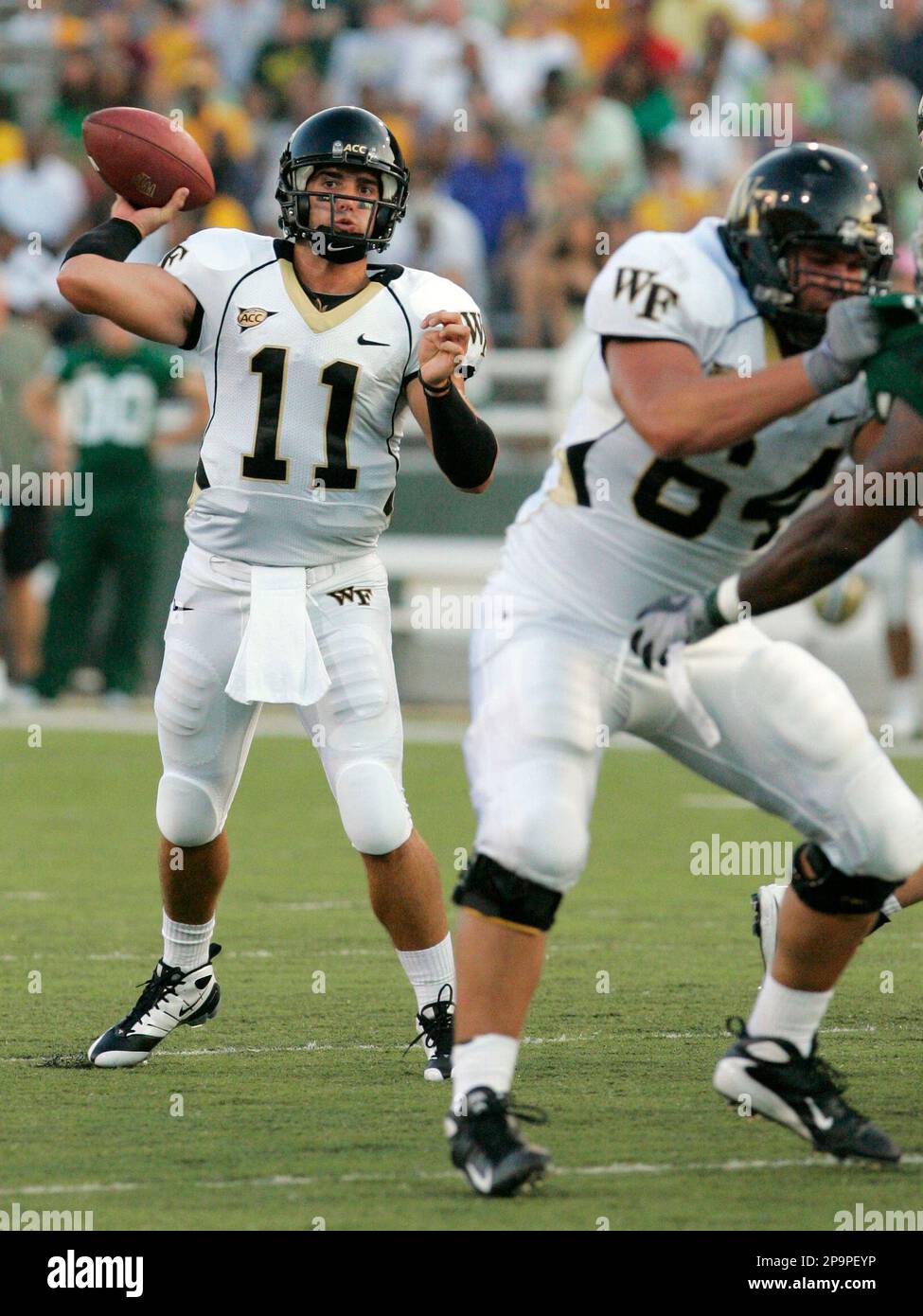 Wake Forest quarterback Riley Skinner (11) throws a touchdown pass as ...