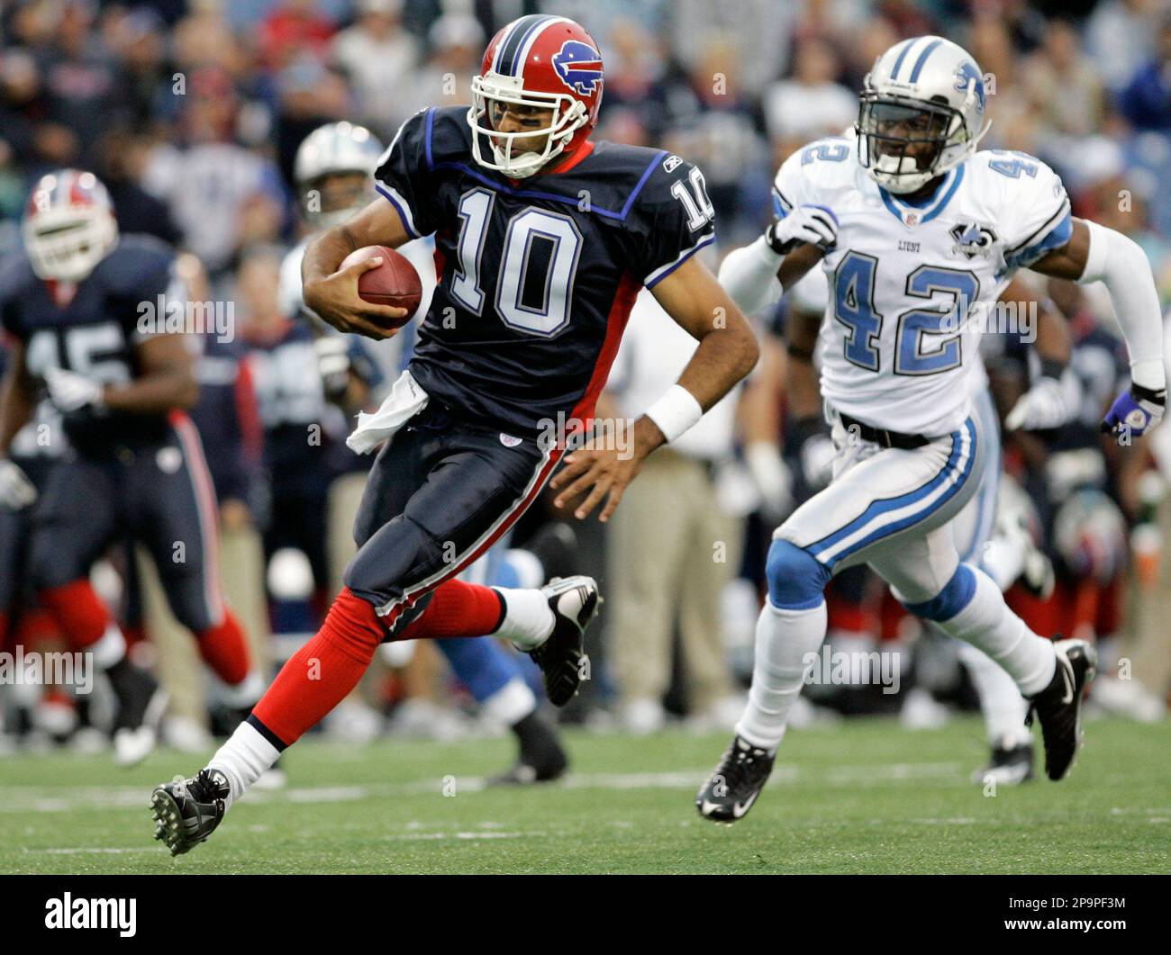 Buffalo Bills quarterback Gibran Hamdan runs under pressure from ...