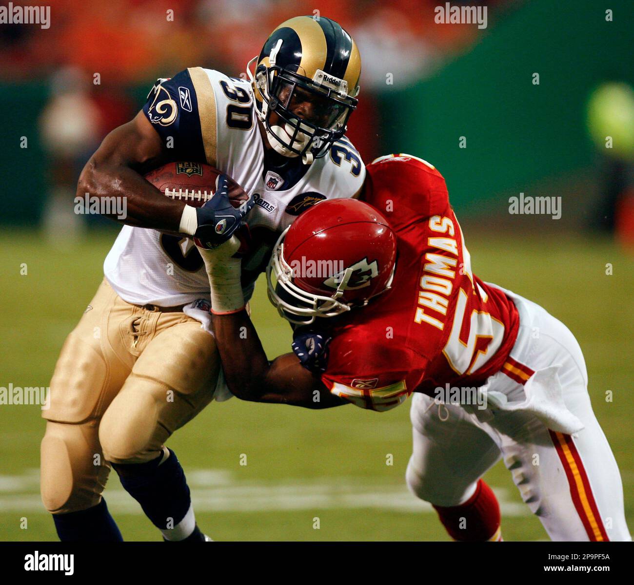 St. Louis Rams running back Antonio Pittman (30) is brought down for a ...