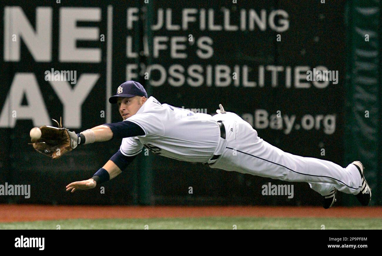 Tampa Bay Rays left fielder Eric Hinske makes a diving catch on a fly ...