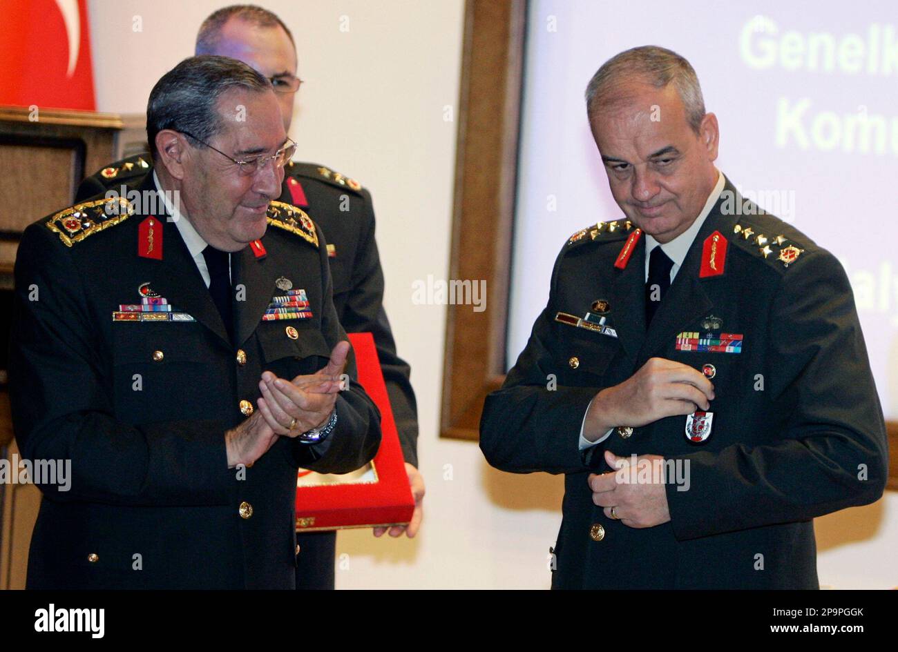 Turkey's former Chief of Staff Gen. Yasar Buyukanit, left, applauds his ...