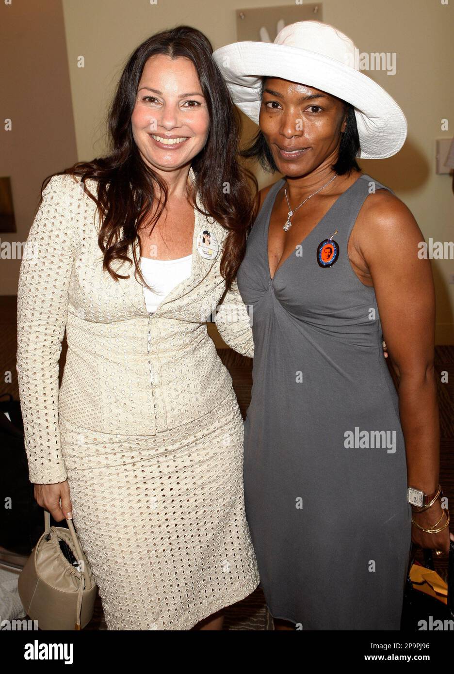 Actresses Fran Drescher, left, and Angela Bassett pose together during ...