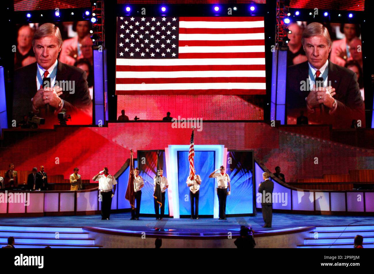 Paul Bucha, of Ridgefield, Conn., right and on screens above, a ...