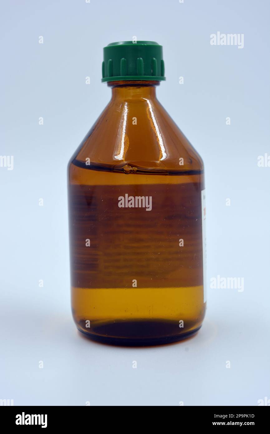 A medical small bottle of medicine with a liquid made of black, brown ...
