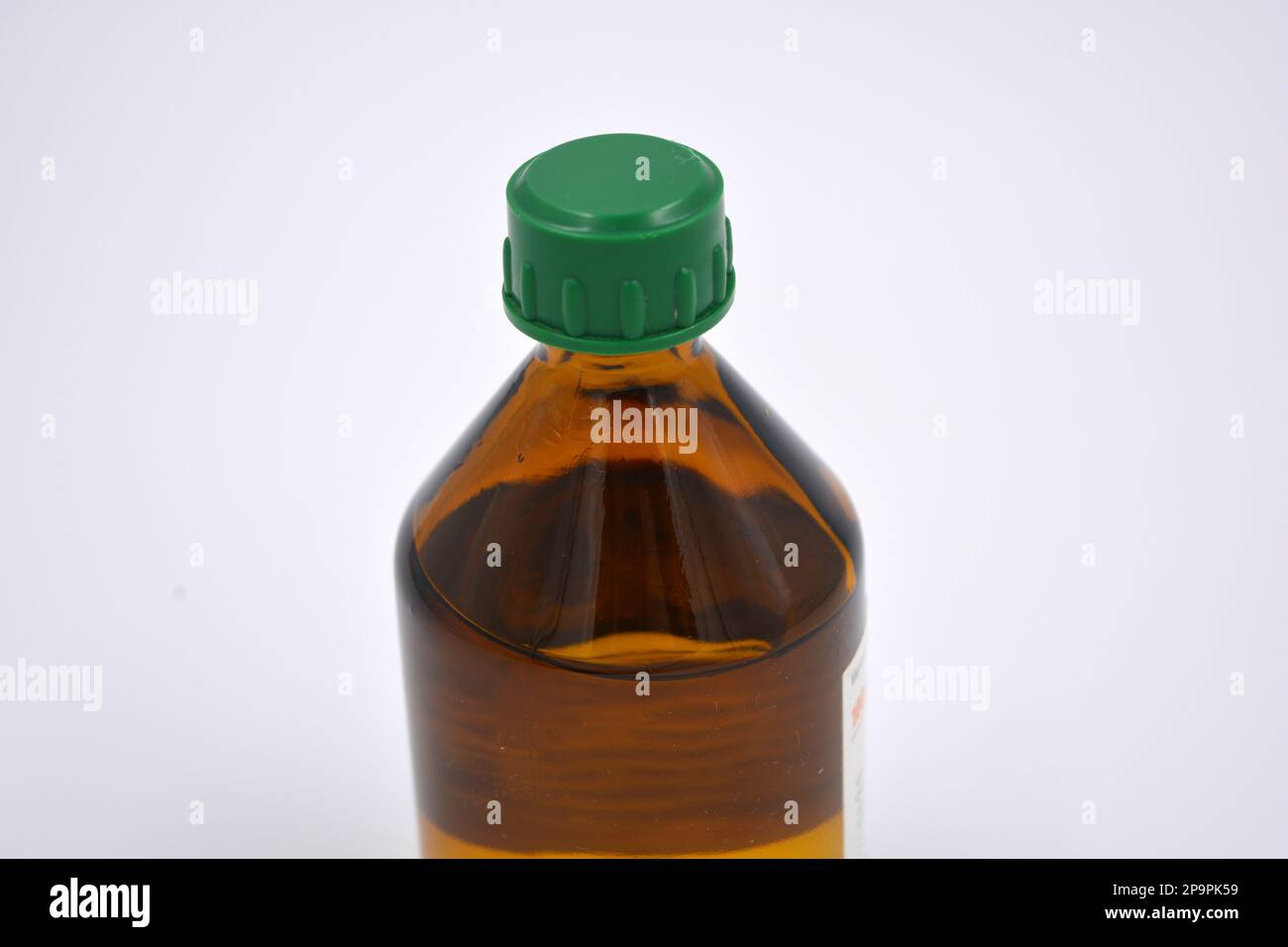 A medical small bottle of medicine with a liquid made of black, brown ...