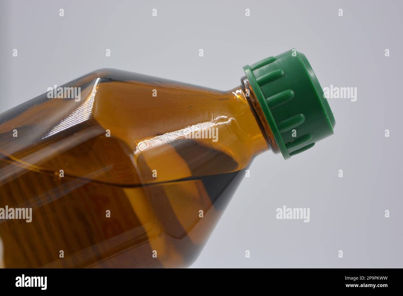 A medical small bottle of medicine with a liquid made of black, brown ...