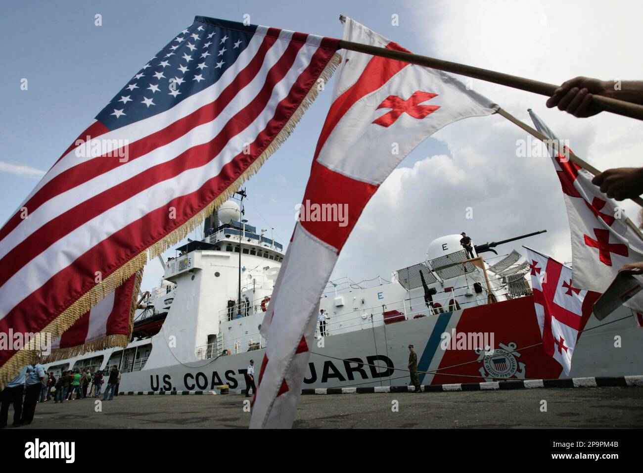 The U.S. Coast Guard cutter Dallas is seen as Georgians wave the U.S ...