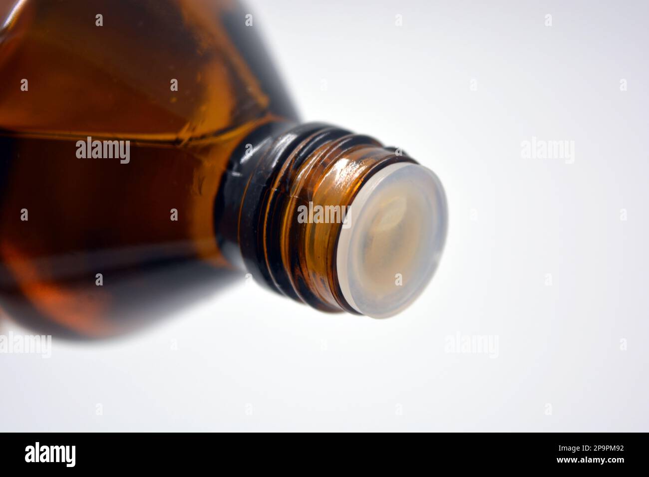 A medical small bottle of medicine with a liquid made of black, brown ...