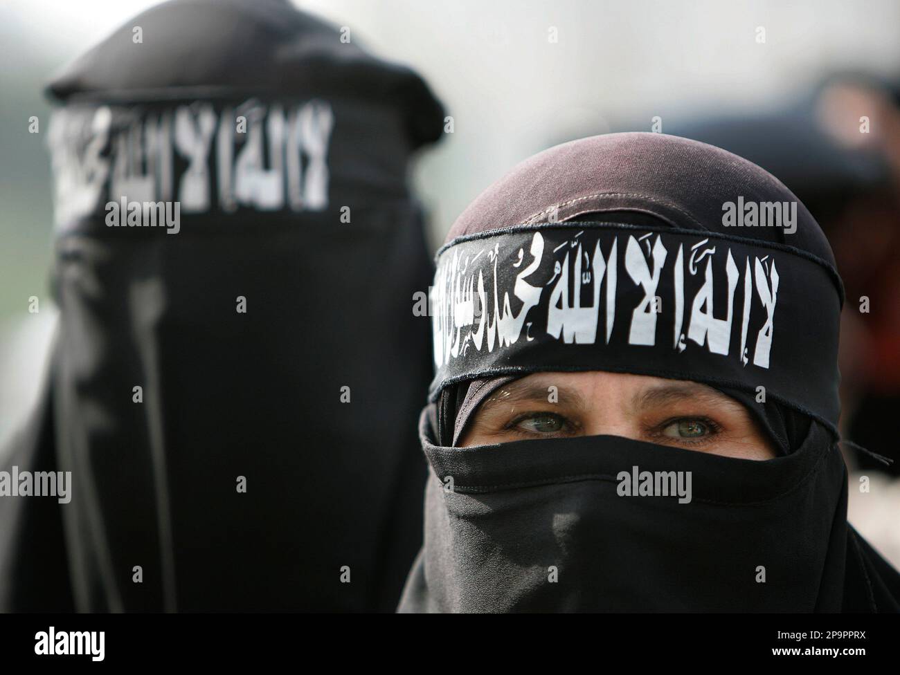 Two Sunni Muslim women with Islamic head bands, asking for the release ...