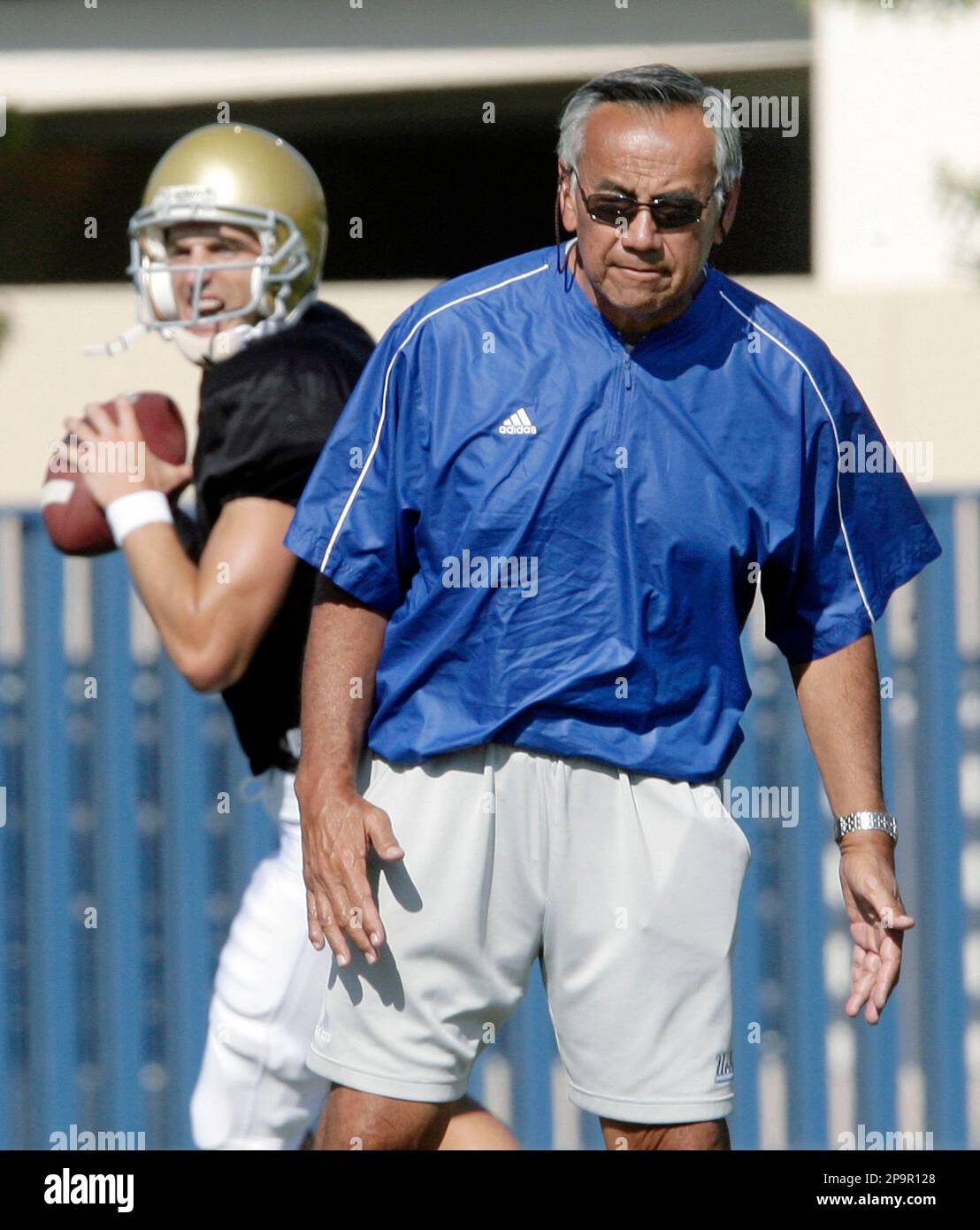 UCLA offensive coordinator Norm Chow, right, works with quarterback ...