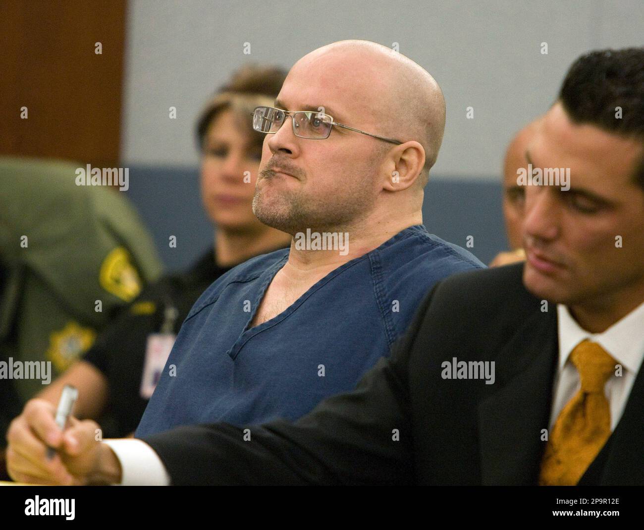 Professional bodybuilder Craig Titus sits with his attorney Marc ...