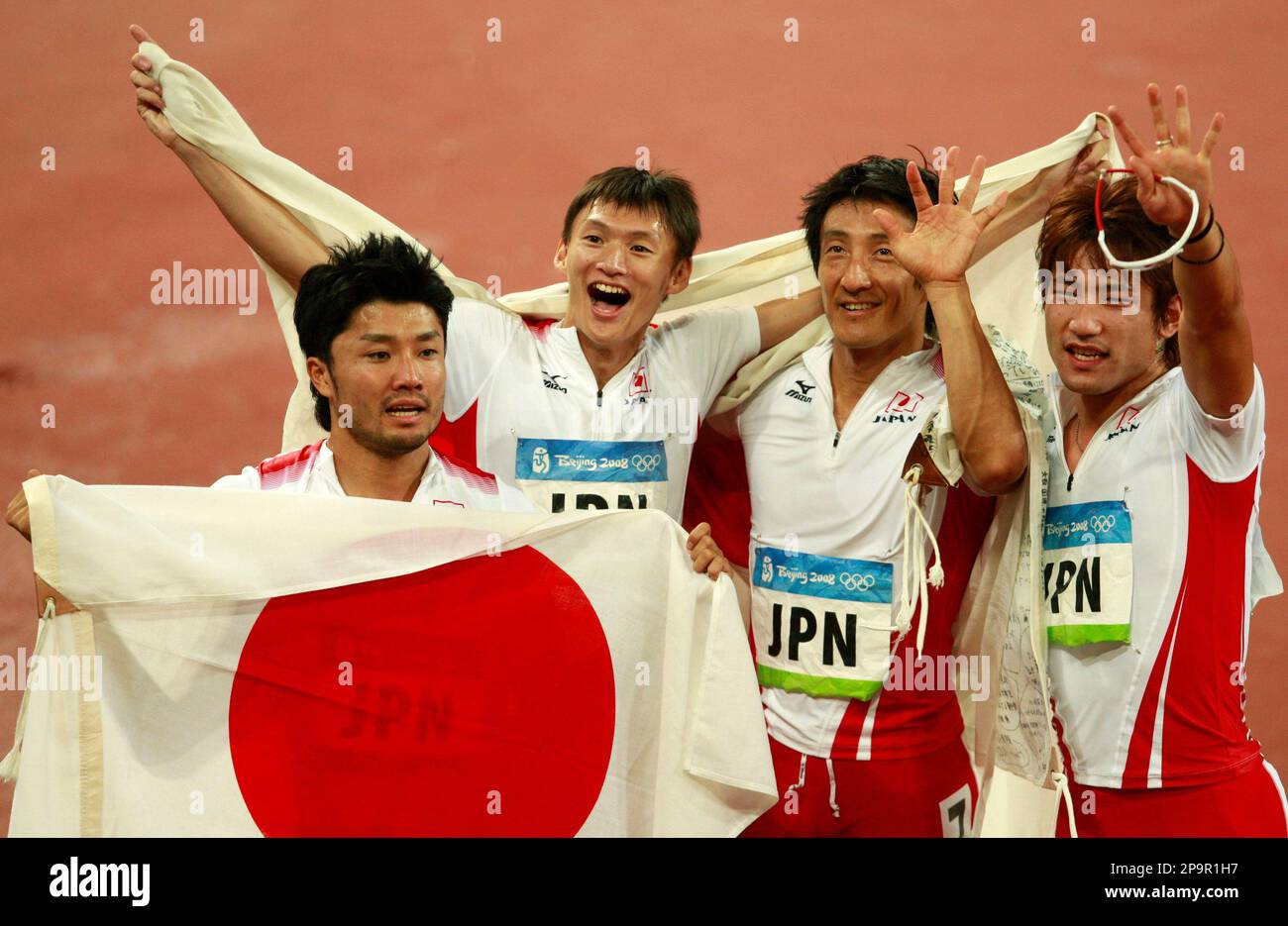 The Japanese 4x100-meter relay team celebrate their bronze medal win in ...