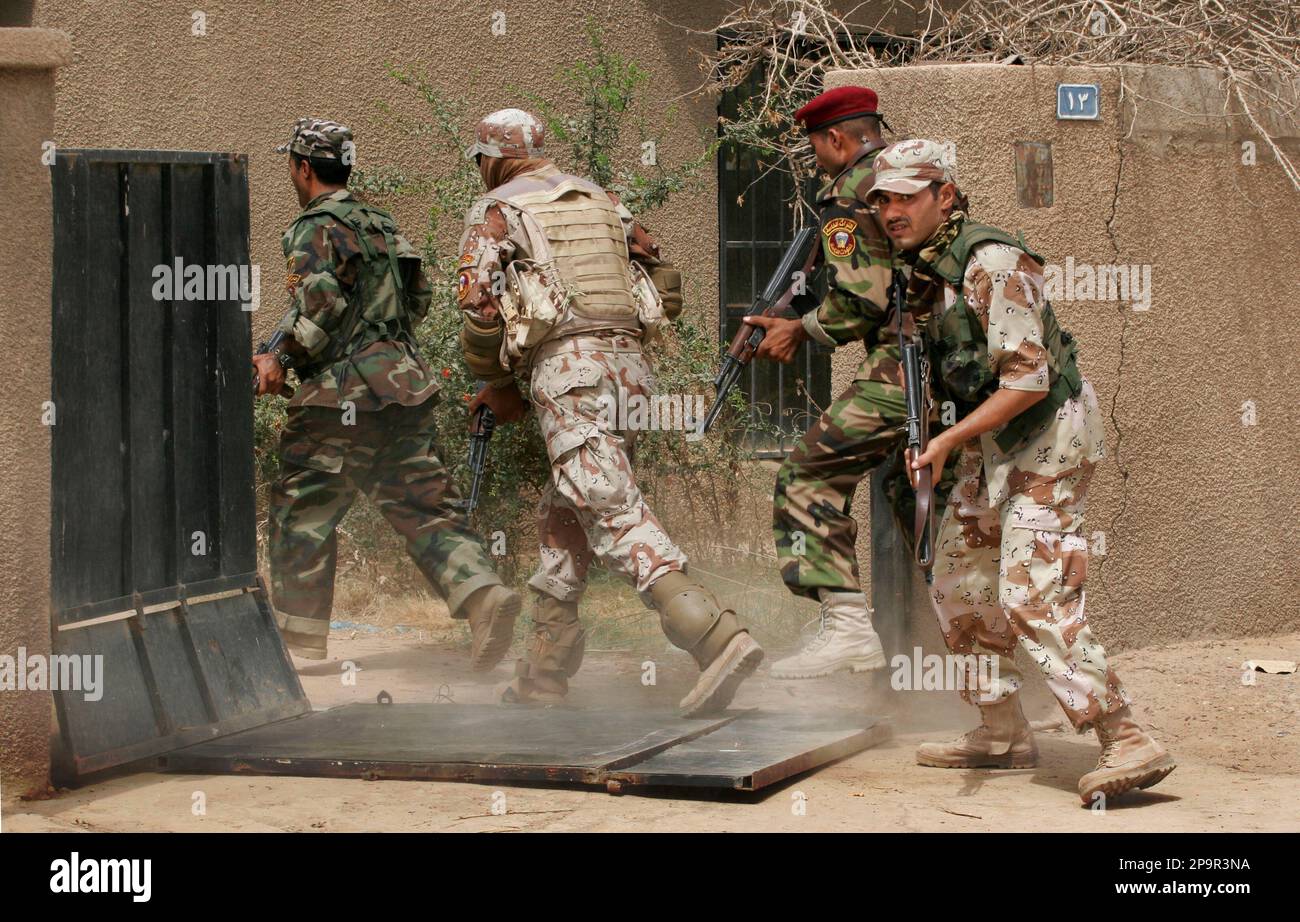 Iraqi Army soldiers conduct house raids in west Baghdad, Iraq, Thursday ...