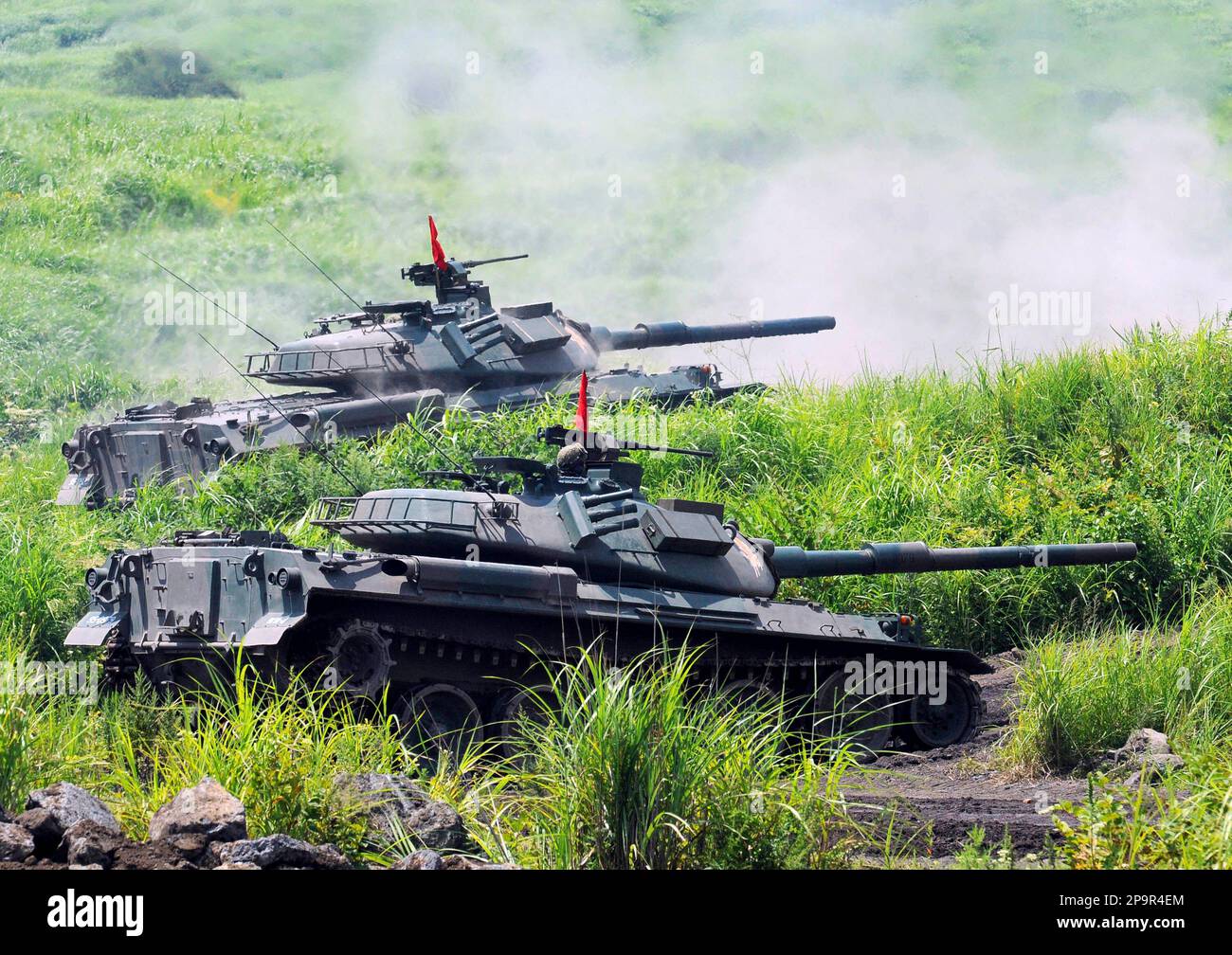 Tanks of Japan's Ground Self-Defense Force fire shells during a ...