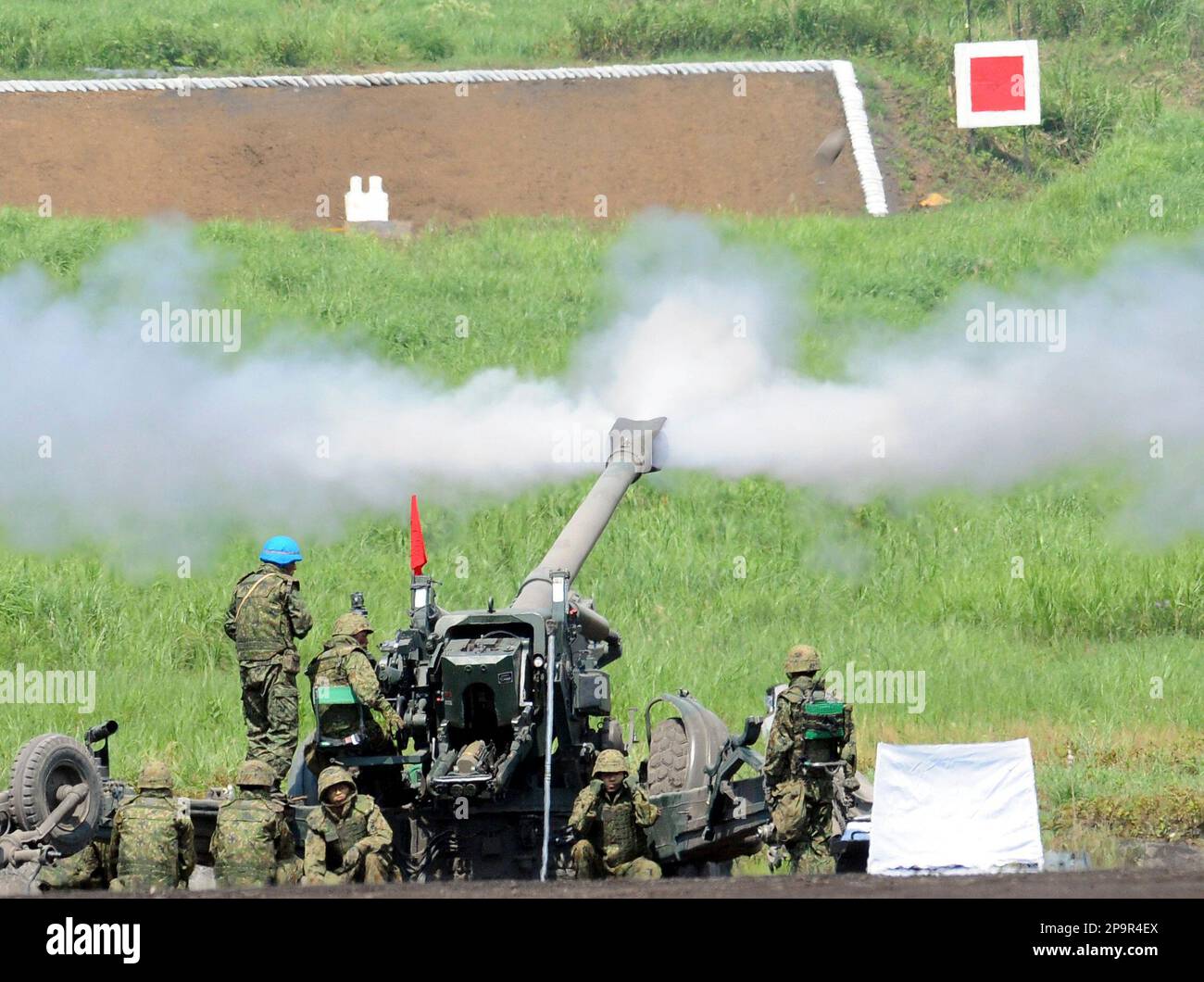 Soldiers of Japan's Ground Self-Defense Force fire a shell during a military exercise at the ...
