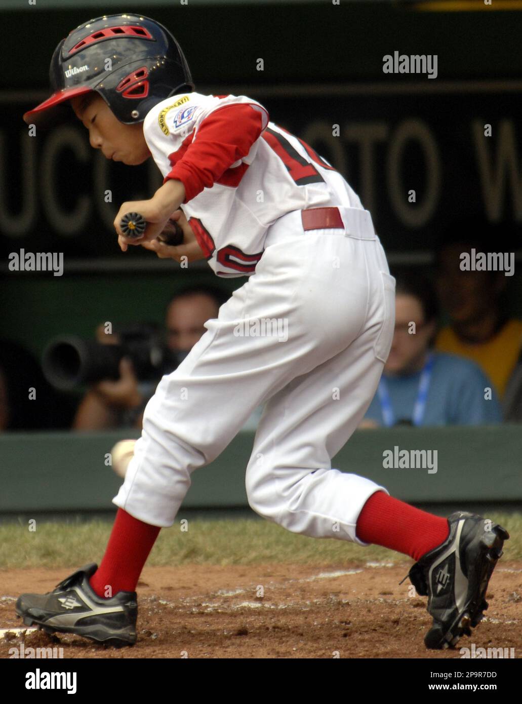 Tokyo, Japan's Akihiro Takeuchi gets hit by a pitch from Maracaibo ...