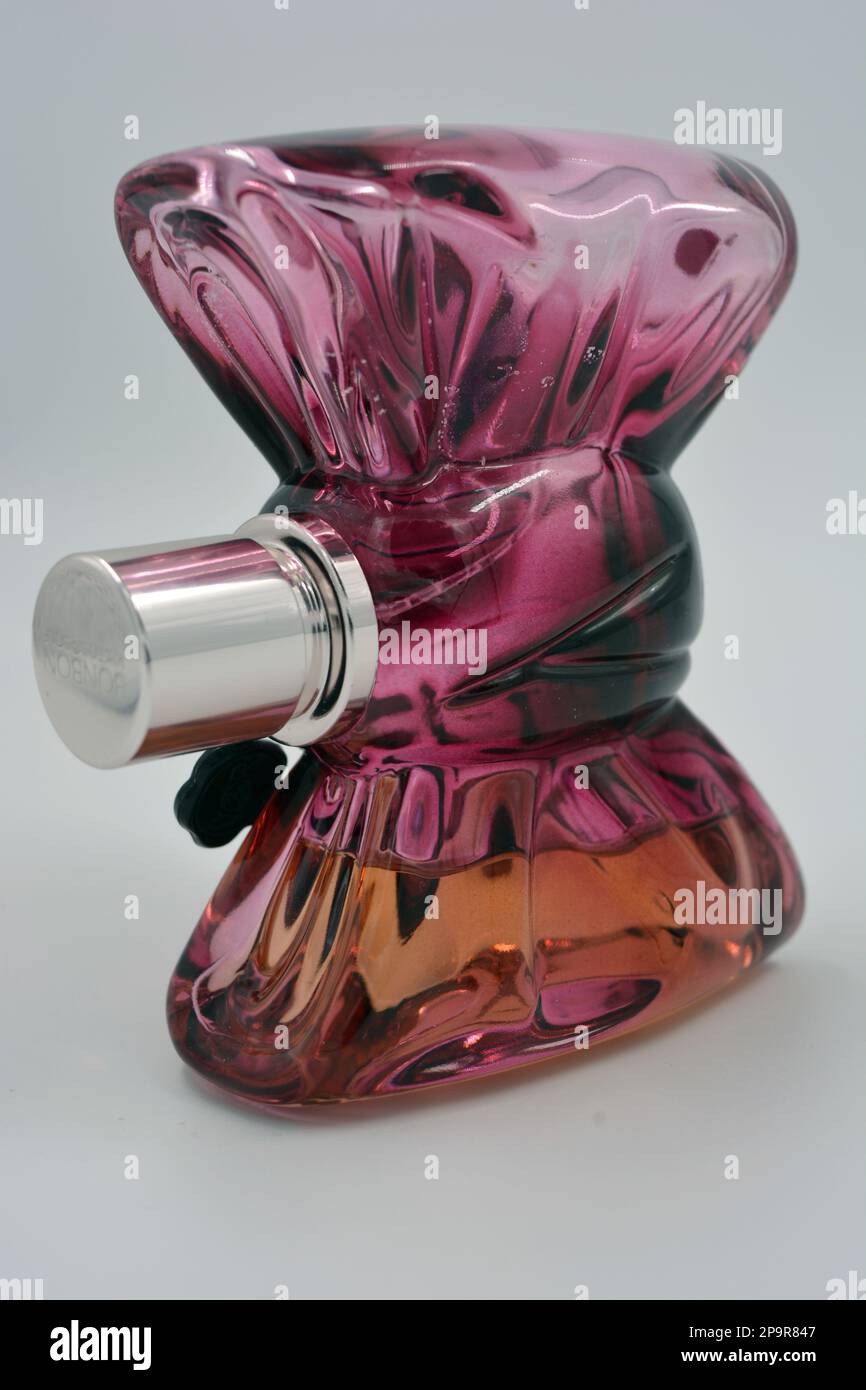 A beautiful red, cherry, plum bottle of women's perfume in the form of ...