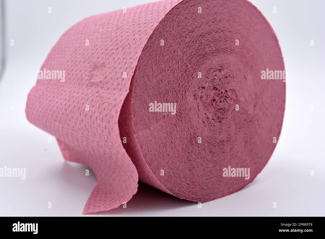 Items, hygiene products, pink toilet paper with a relief, textured ...