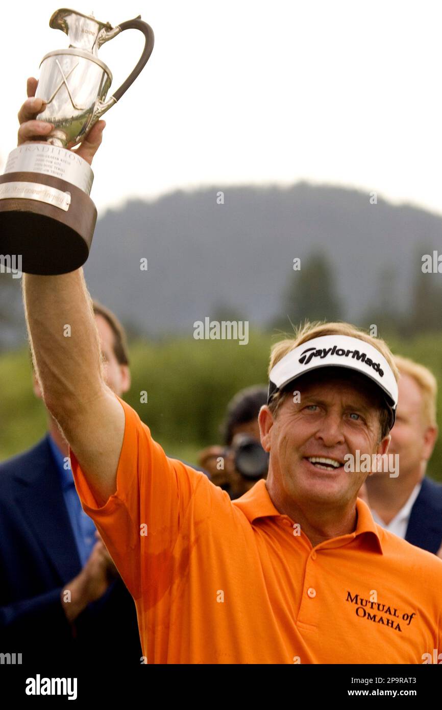 Fred Funk, from Ponte Vedra Beach, Fla., holds up his trophy after ...