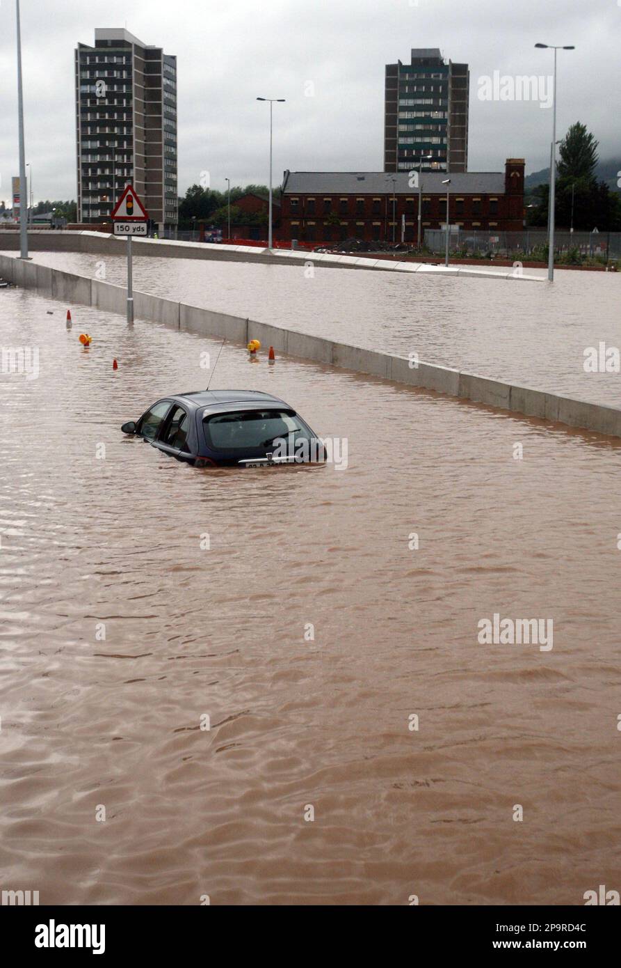 A car abandoned on the Westlink Road is seen at the junction with the ...